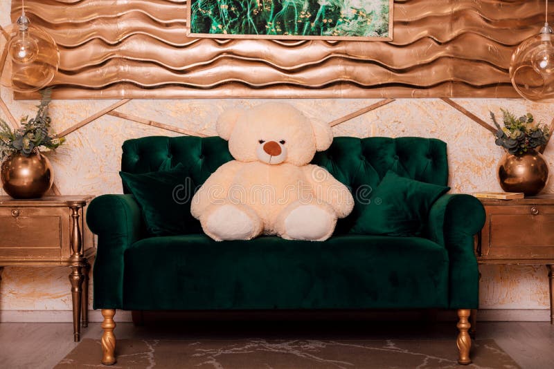 A Teddy Bear on a Green Sofa. Modern Interior Stock Image - Image of ...