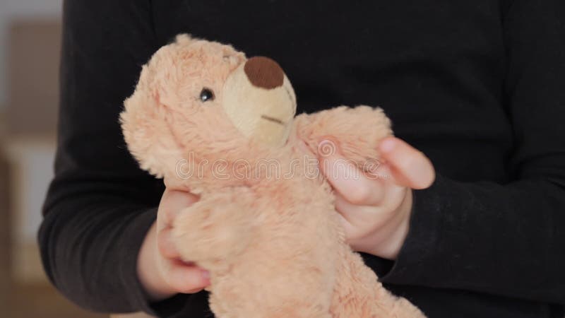 Teddy Bear in Hands of a Little Child Stock Video - Video of white, playing: 384507309