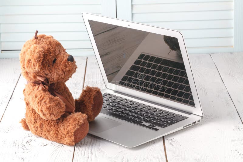 LAPTOP COMPUTER And TEDDY BEAR Stock Photo - Image of silver, laptop ...