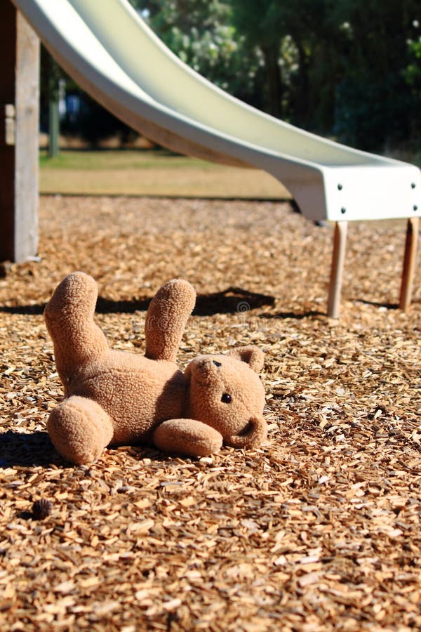 Teddy bear in a playground stock photo. Image of play - 23649790