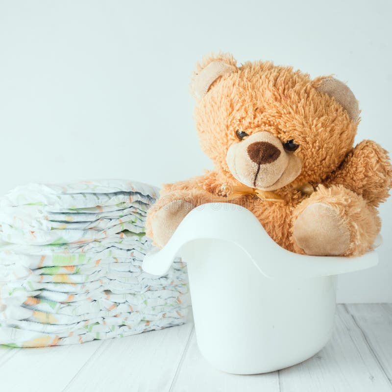 Teddy Bear Potty Next To Stack Diapers Stock Photos - Free & Royalty ...