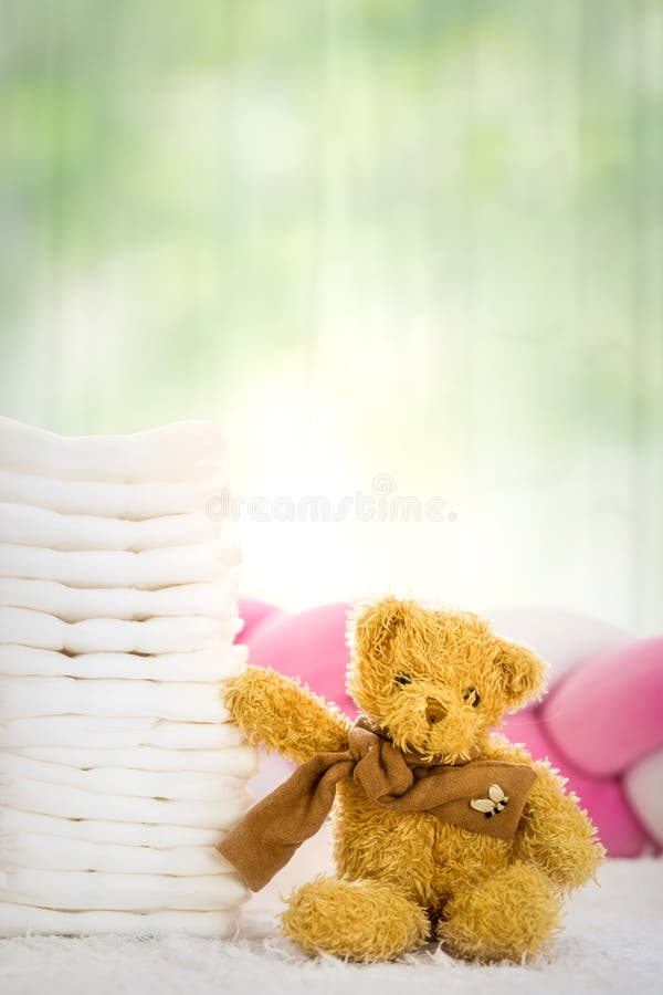 Teddy Bear and Stack Disposable Diapers Stock Image - Image of stuffed ...