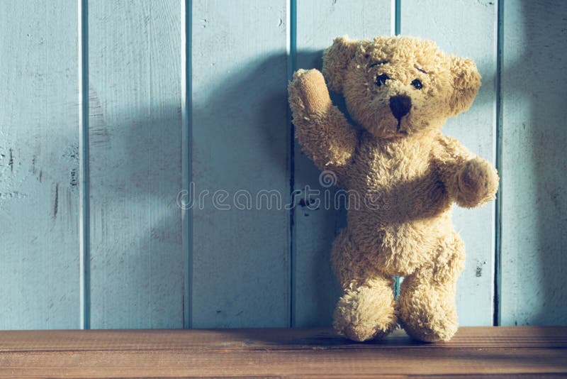 Teddy Bear Stands in Front of a Blue Wall Stock Image - Image of little ...