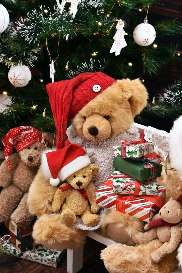 Teddy Bears Sitting on the Bench with Stack of Gift Boxes at Christmas ...