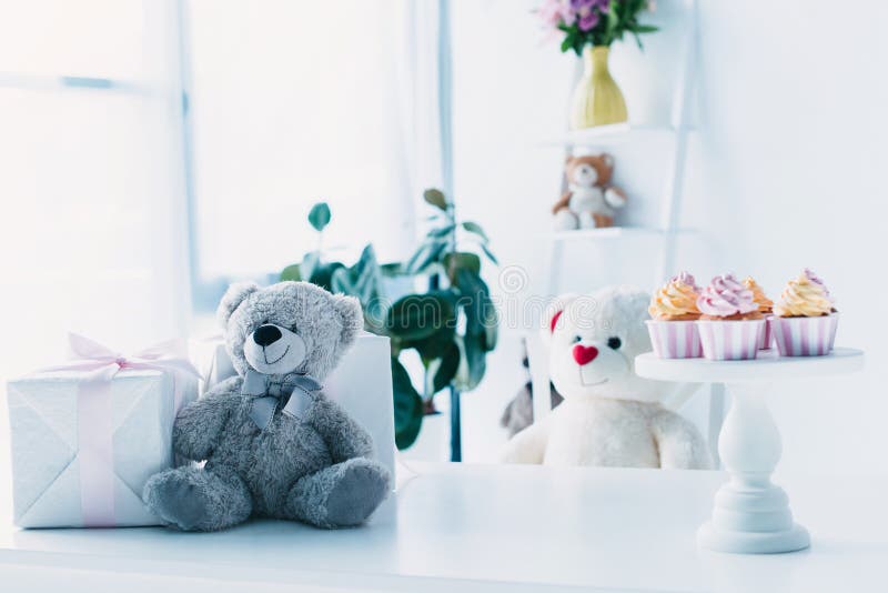 Teddy Bears on Table with Present Box and Cupcakes Stock Photo - Image ...