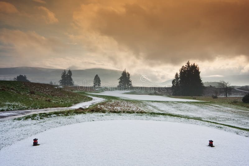 Tee on a snowy golf course stock photo. Image of cloud - 16179186