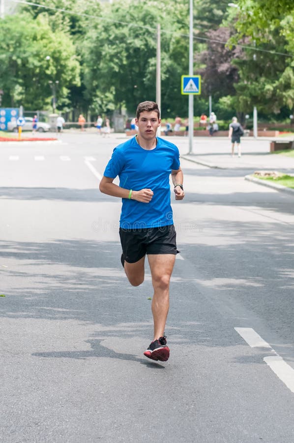 Teen Athlete Training by Running on Street Stock Image - Image of teen ...