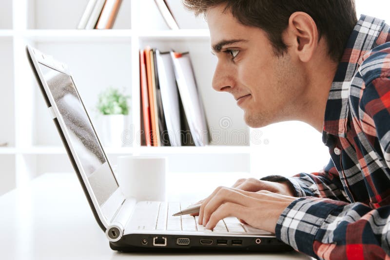 Teen boy on laptop stock image. Image of hands, laptop - 81730489