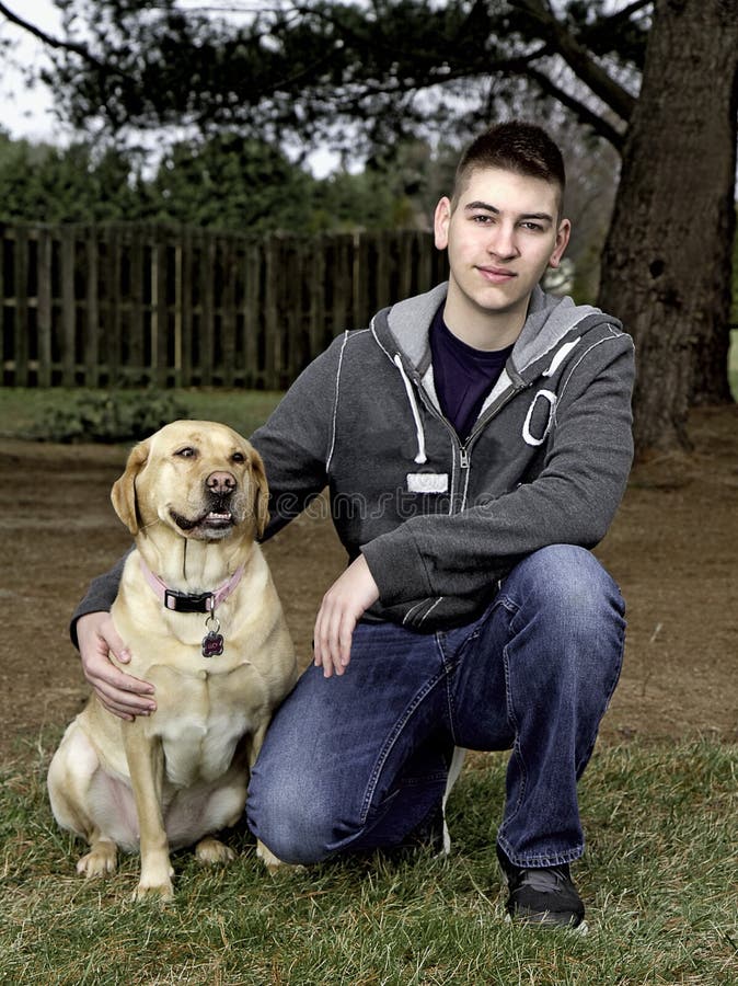 Teen Boy Outdoors with Yellow Lab Stock Image - Image of sitting ...