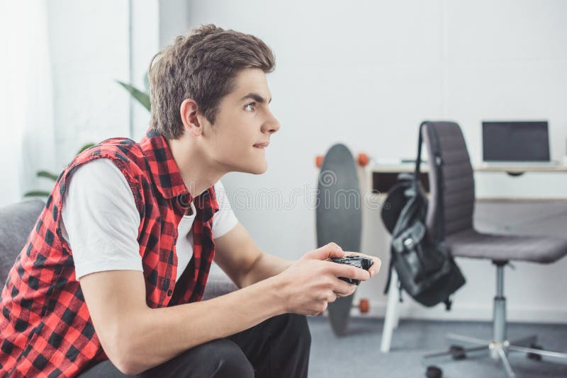 Teen Boy Playing Video Game with Gamepad Stock Image - Image of youth ...