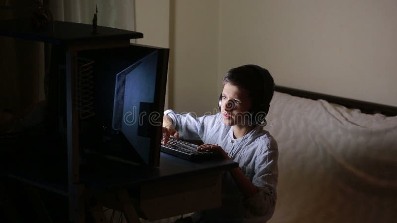 Teen Boy Plays Games on the Computer at Night. Online Games Stock ...