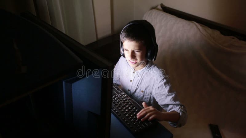 Teen Boy Plays Games on the Computer at Night. Online Games Stock ...