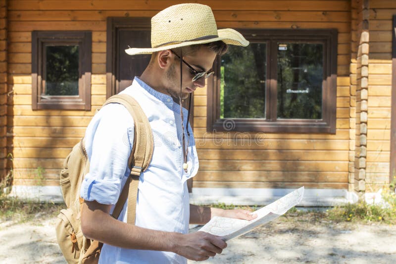 Teen boy reading map stock image. Image of footpath - 107280763