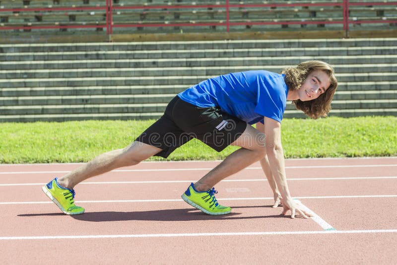 Teen Boy Ready To Run Outside on a Training Field Stock Photo - Image ...
