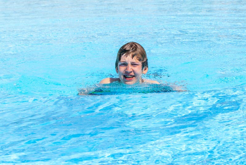 Teen Boy Swimming in a Pool Stock Photo - Image of holiday, beautiful ...