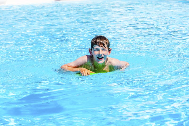 Teen Boy Swimming in a Pool Stock Photo - Image of recreation ...
