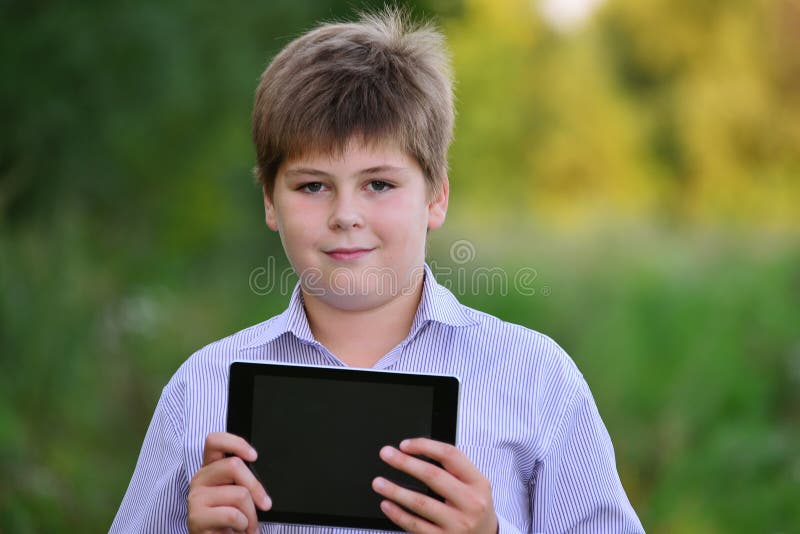 Teen Boy with Tablet Computer at Nature Stock Photo - Image of netbook ...