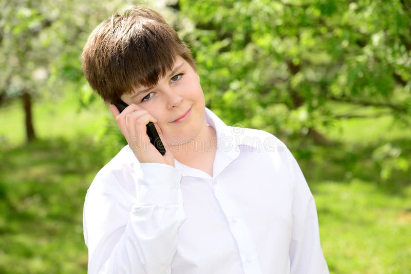 Teen Boy Talking on Phone Outdoors Stock Image - Image of modernity ...