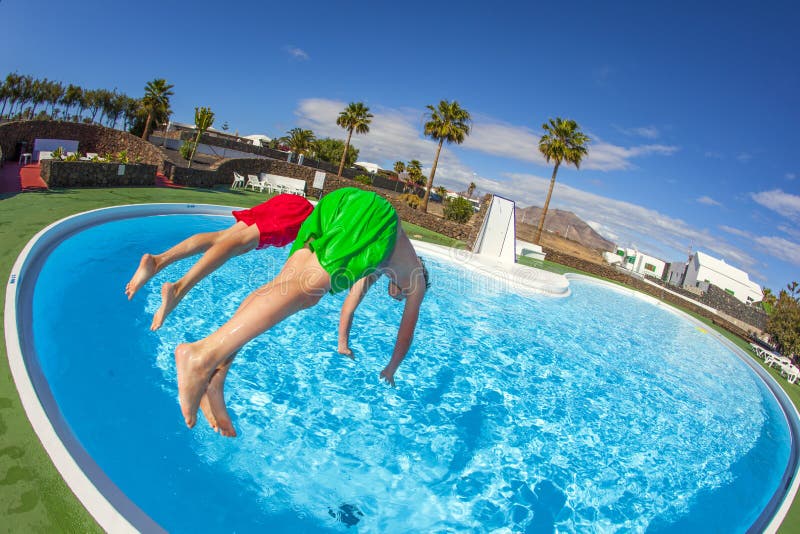 Teen Boys Jumping in the Blue Pool Stock Image - Image of beautiful ...