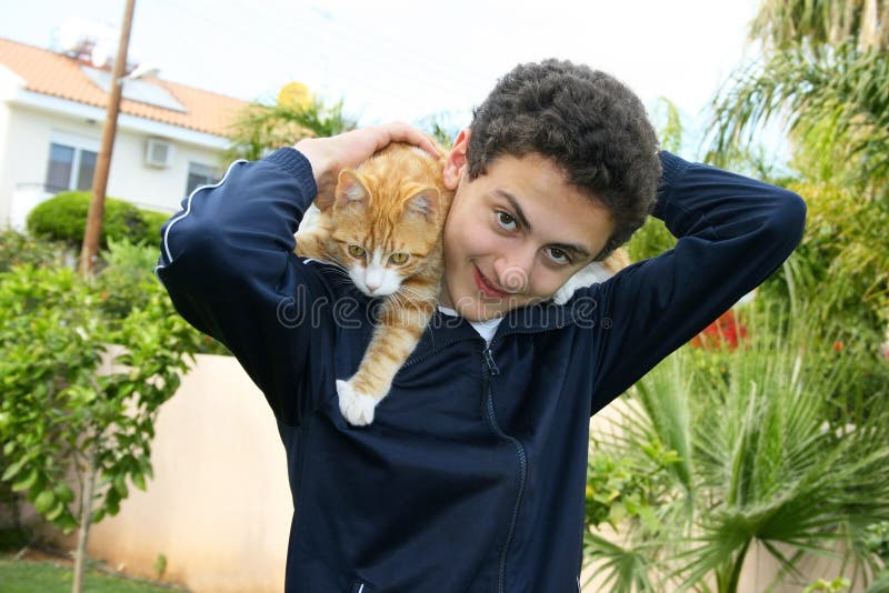Teen and cat stock photo. Image of halfbody, casual, puberty - 13034296