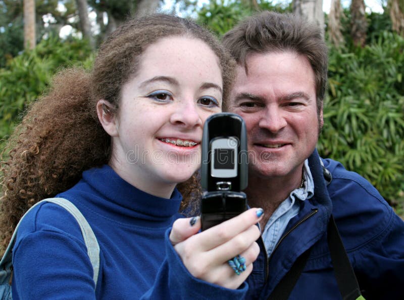 Teen Dad & Camera Phone Stock Photo - Image of child, aged: 503984