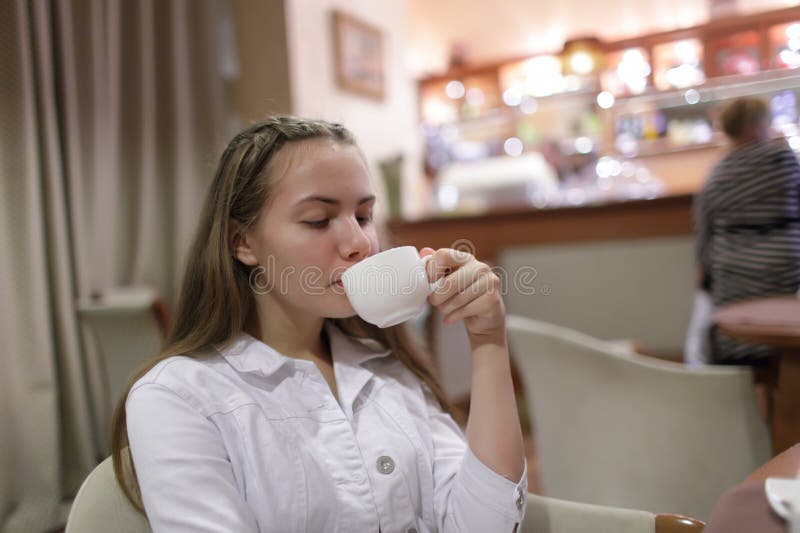 Teen drinking tea stock photo. Image of food, sitting - 26559792