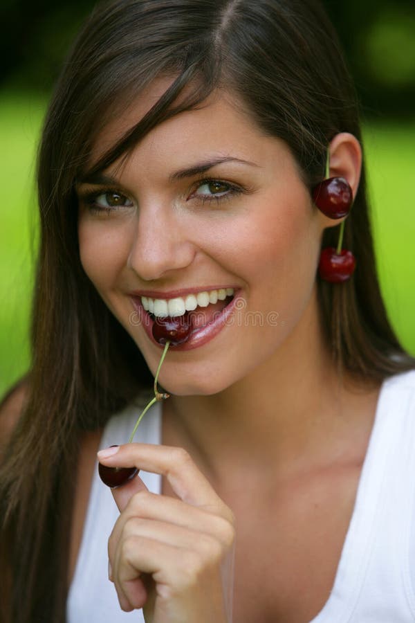 Teen eating cherry stock image. Image of fresh, fruit - 10353377