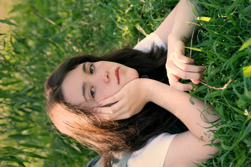 Teen girl in grass 2 stock image. Image of alone, girl - 6508205