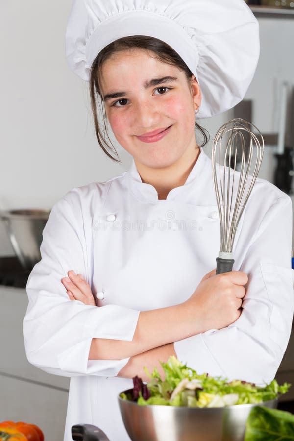 Teen girl in the kitchen stock photo. Image of gourmet - 68872474