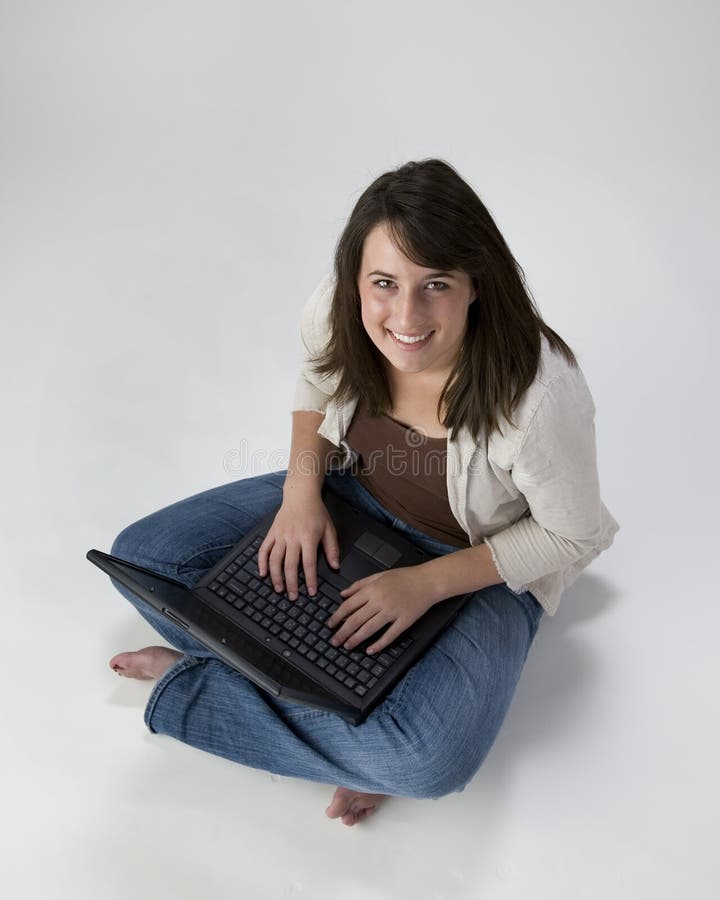 Teen girl using laptop stock image. Image of feet, electronics - 2601551