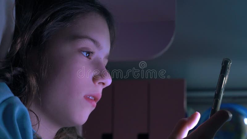 Teen Girl Lying in Bed at Night and Using Smartphone. Stock Footage ... Teen Girl Lying in Bed at Night and Using Smartphone. Stock Footage ...