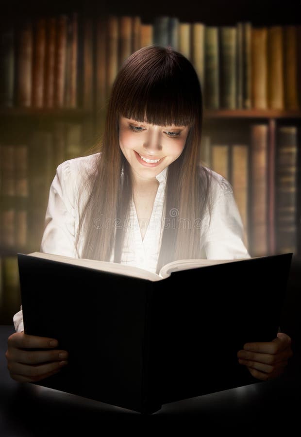 Girl reading magic book stock photo. Image of darkness - 40181976