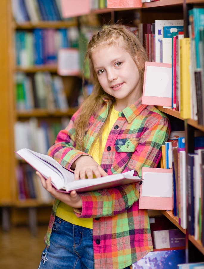 Teen Girl Reading a Book in the Library Stock Photo - Image of modern ...