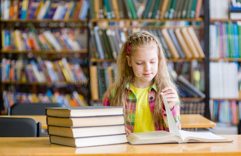 Teen Girl Reading a Book in the Library Stock Photo - Image of ...