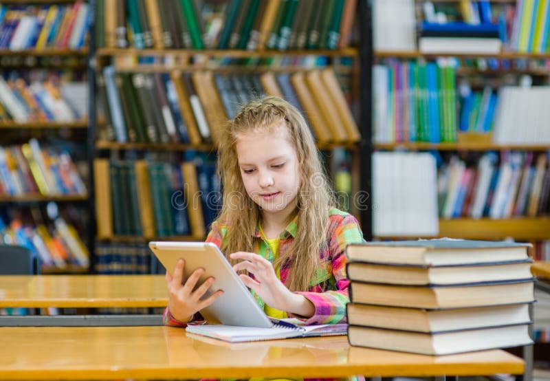 Teen Girl with Tablet Computer Working in Library Stock Photo - Image ...