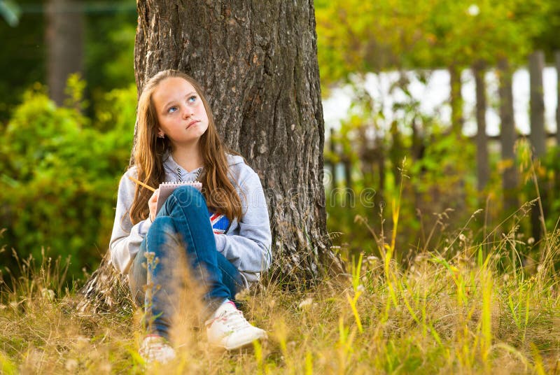 Teen-girl Writing in a Notebook Stock Photo - Image of notebook ...