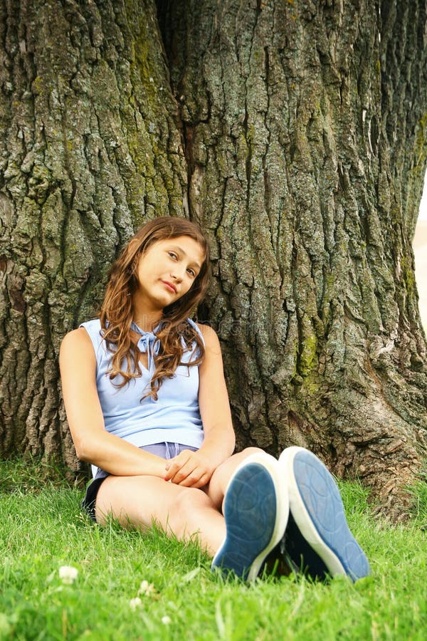 Teen sit on a tree stock photo. Image of straight, woman - 27327066