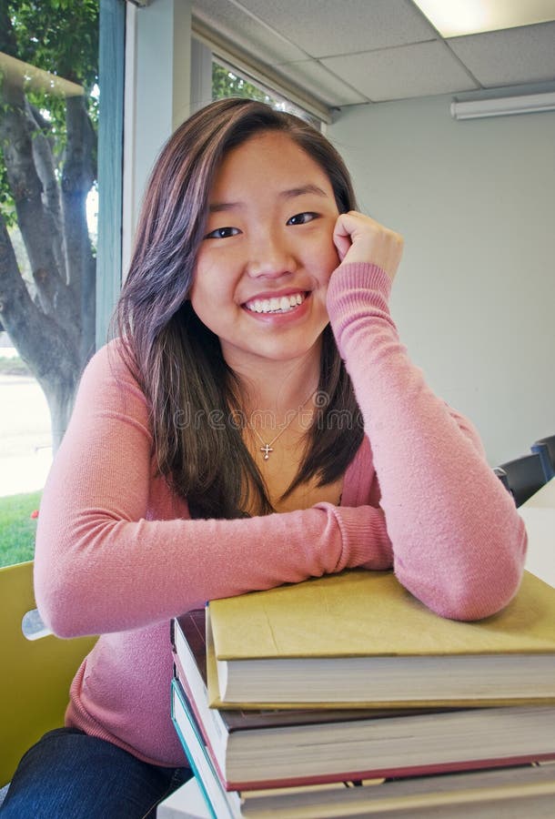 Teen Student with Book Stack Stock Photo - Image of smile, teen: 16156988