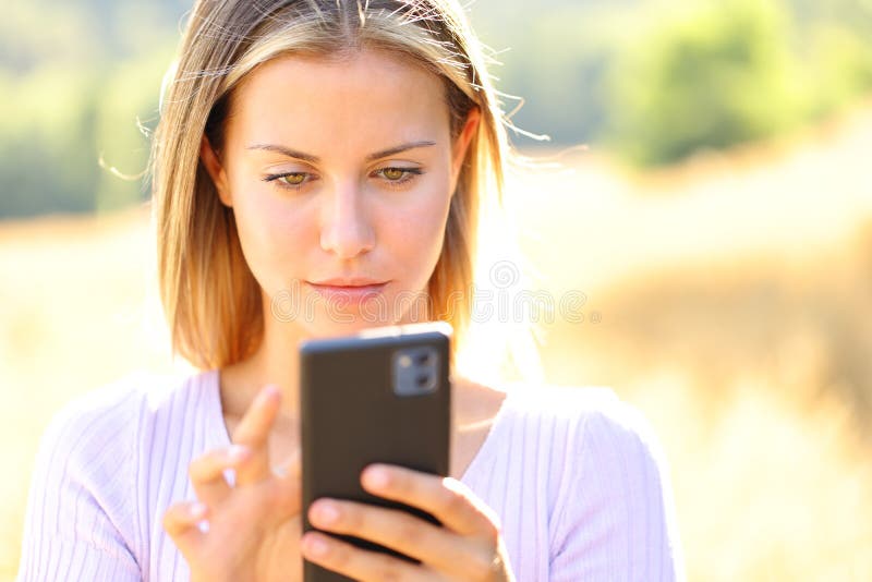 Teen Using Cell Phone in Nature Stock Photo - Image of booking, people ...
