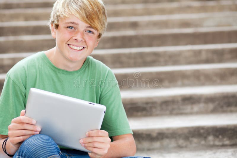 Teen using tablet computer stock image. Image of technology - 24783723