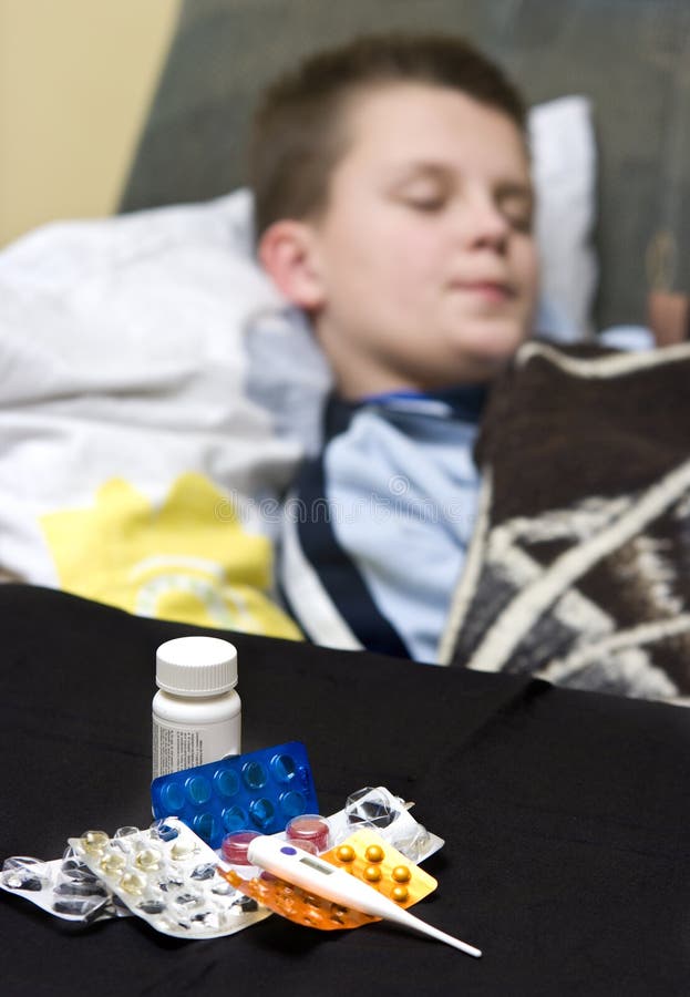 Teenage boy in bed sick stock image. Image of bedside - 8306871