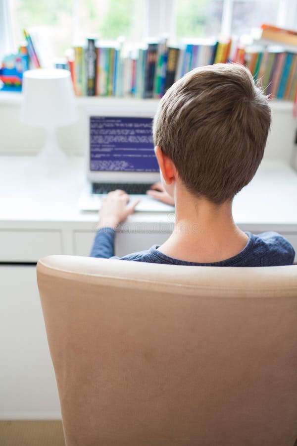 Teenage Boy in Bedroom Writing Computer Code Stock Photo - Image of ...