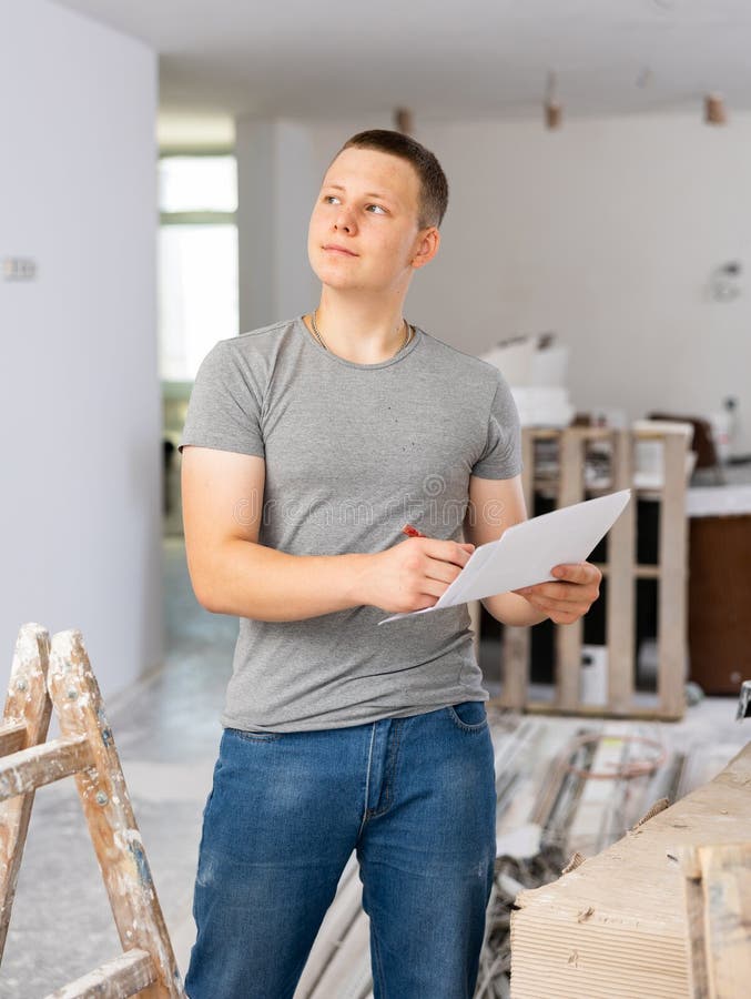 Teenage Boy Checking Documents in Construction Site Stock Photo - Image ...