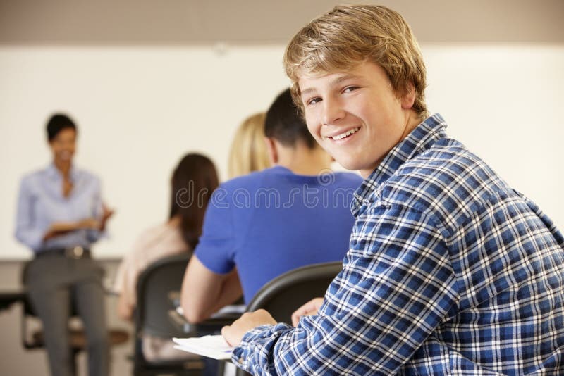 Teenage Boy in Class Smiling To Camera Stock Photo - Image of grade ...