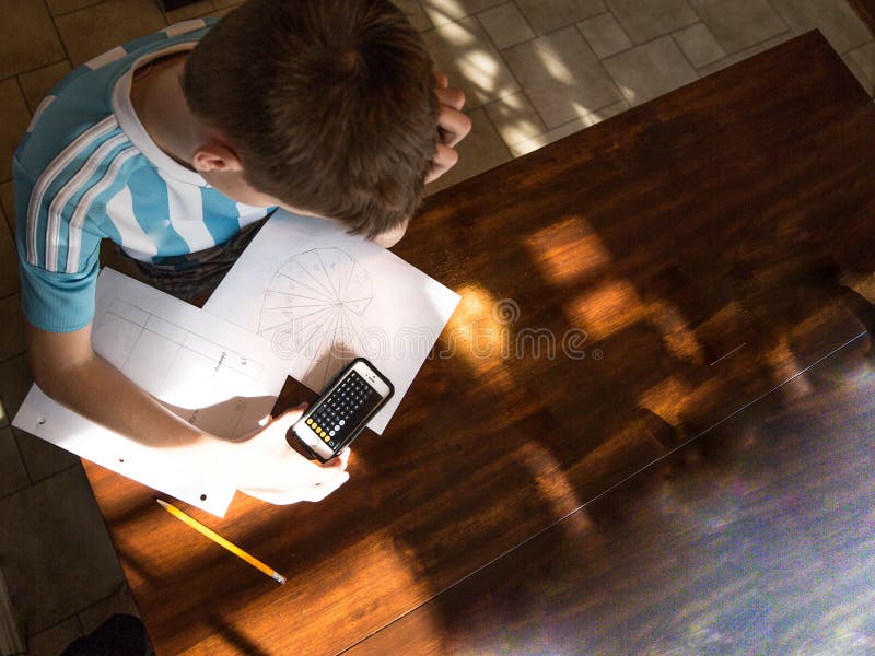 Teenage Boy Completing Math Homework Assignment Stock Photo - Image of ...