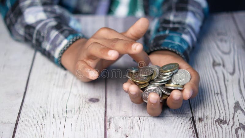A Teenage Boy Counting Coins on Table Stock Video - Video of saving ...