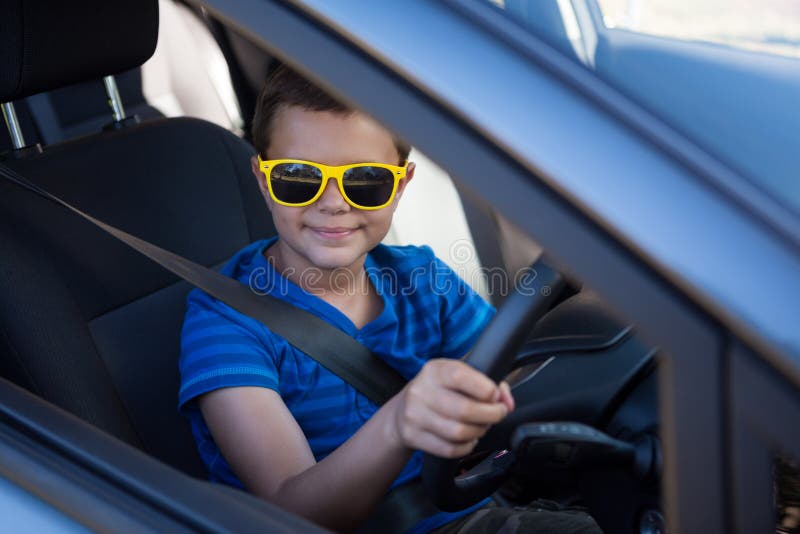 Teenage boy driving a car stock image. Image of lifestyle - 97032515