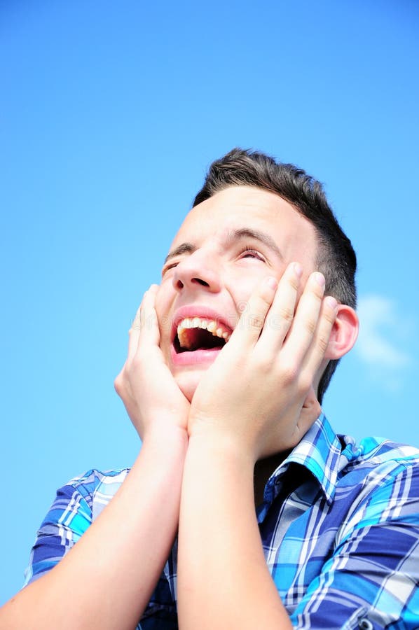 Teenage boy excited stock image. Image of hands, close - 24653633