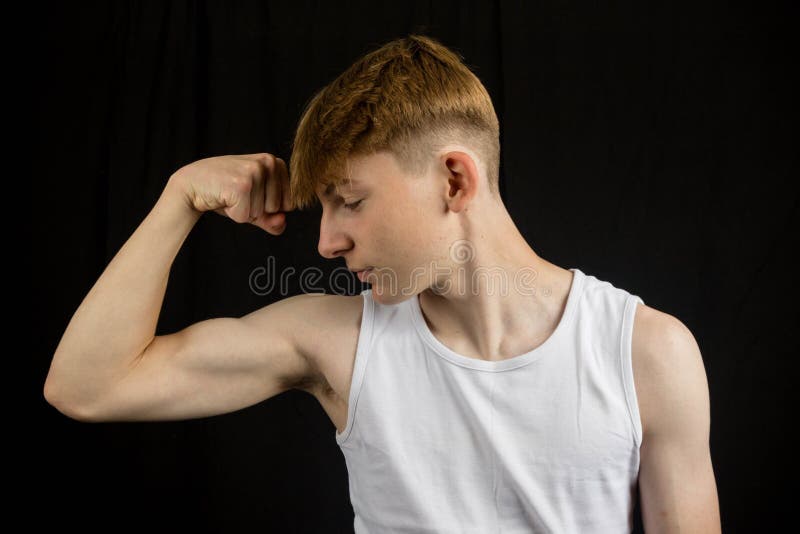 Teenage Boy Flexing His Bicep Stock Photo - Image of workout, handsome ...