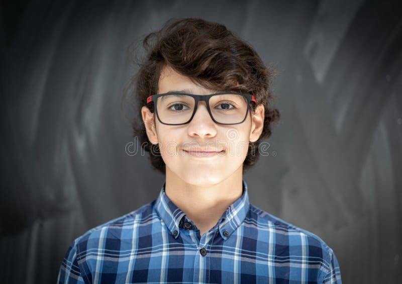 Teenage Boy with Glasses in Front of Classroom Board Stock Photo ...